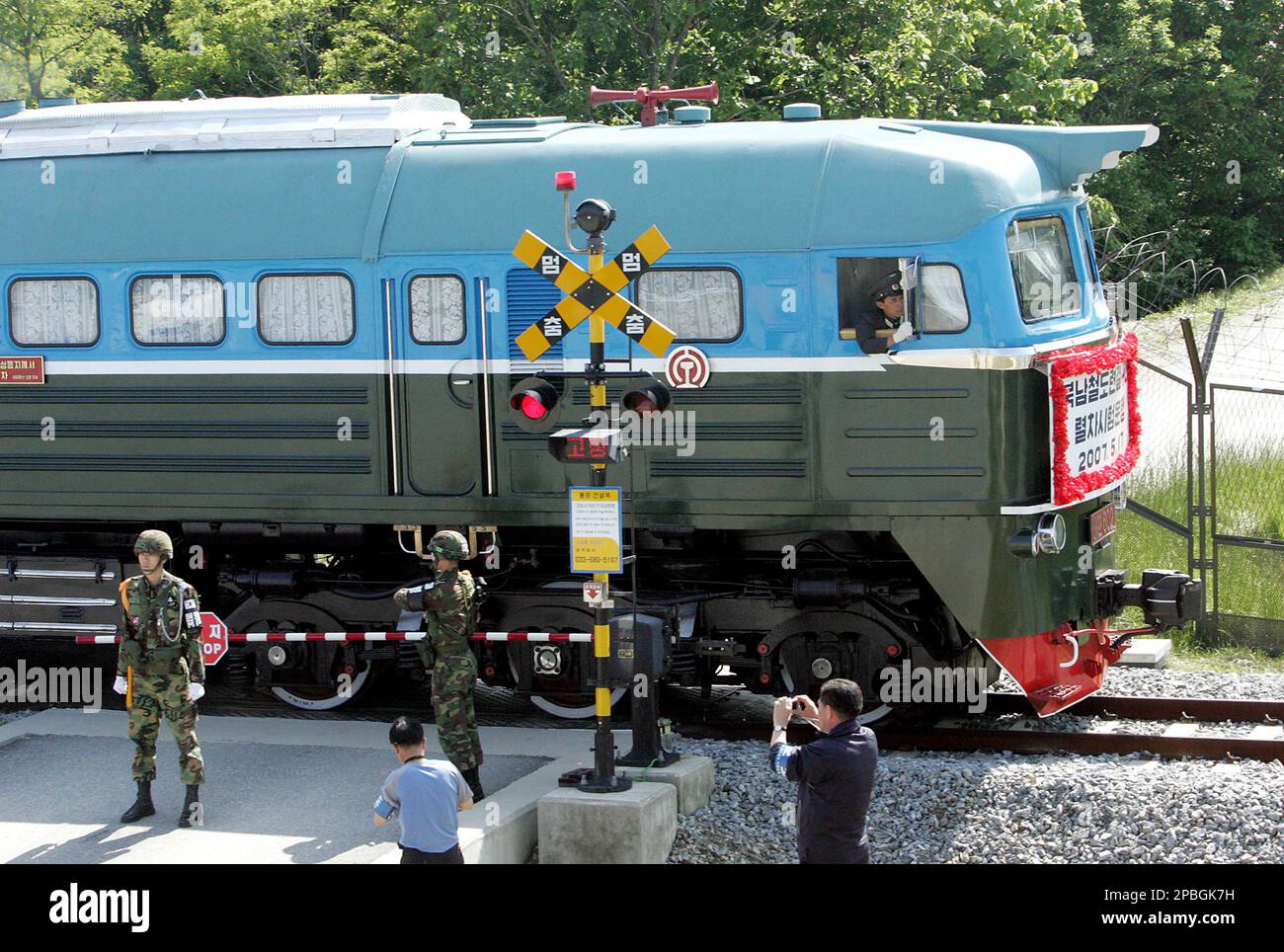 A North Korean train crosses the border line to return their hometown ...