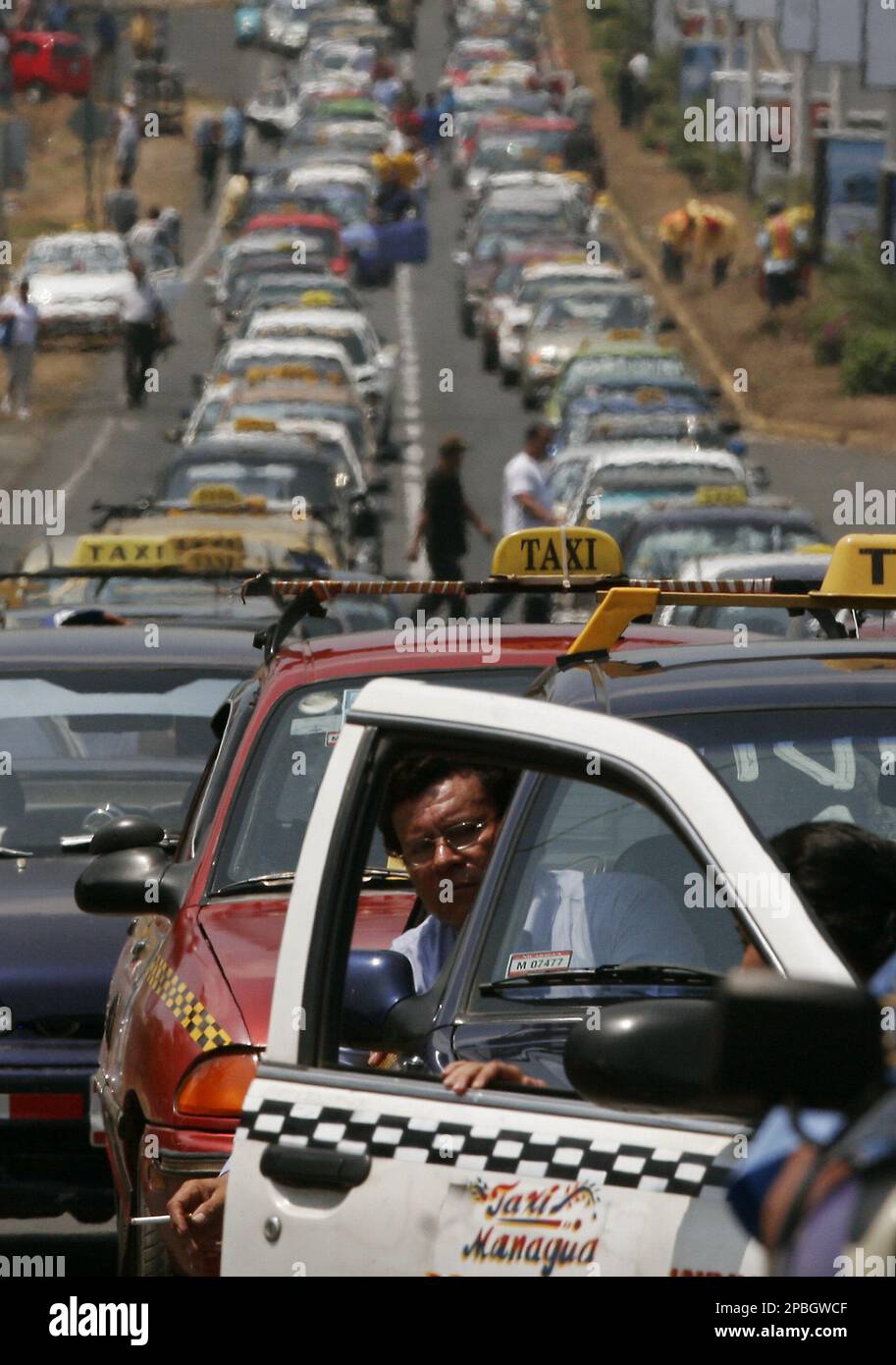 Scores of taxis drive along the streets of Managua during a ...