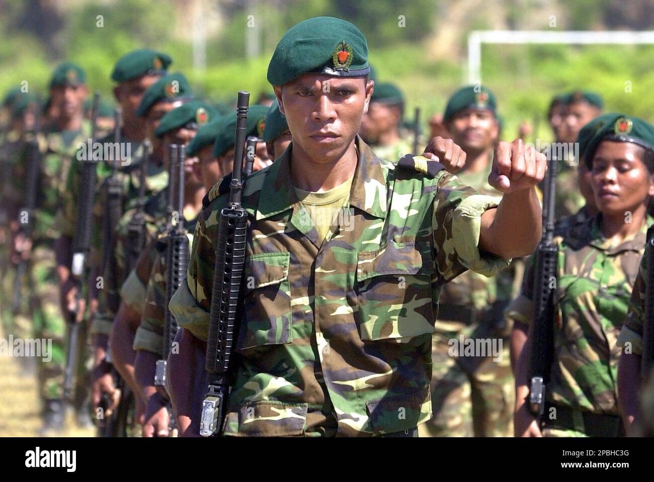 East Timorese soldiers march in a parade during a farewell visit by ...