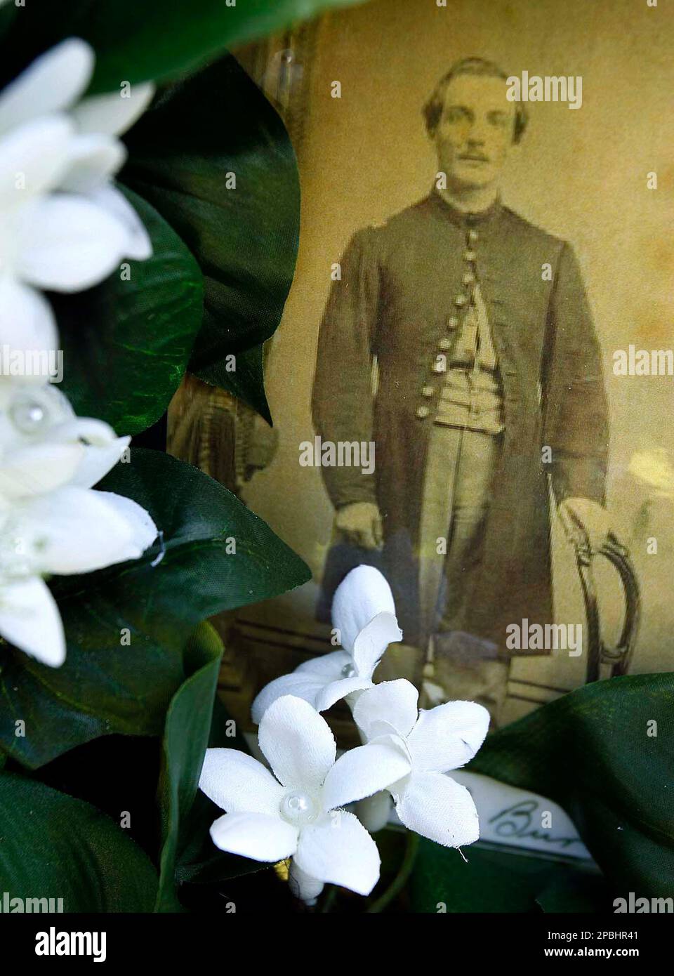 A photo of Lt. Mathew B. Burgher and a wreath were placed at his grave ...