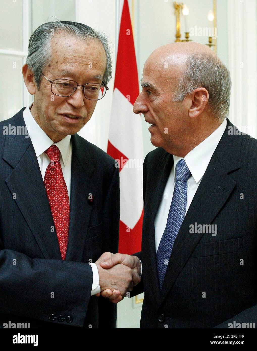 Swiss minister of finance, Hans Rudolf Merz, right, shakes hand of his ...