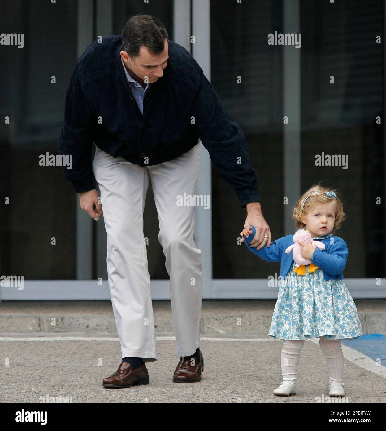 Spain's Crown Prince Felipe holds the hand of daughter Leonor, as they ...