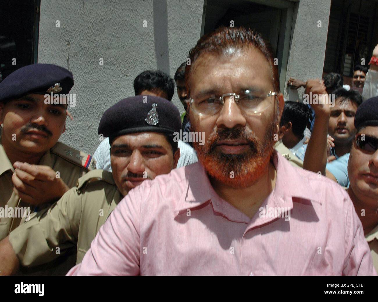 Deputy Inspector General border range D G Vanzara, center, looks on ...