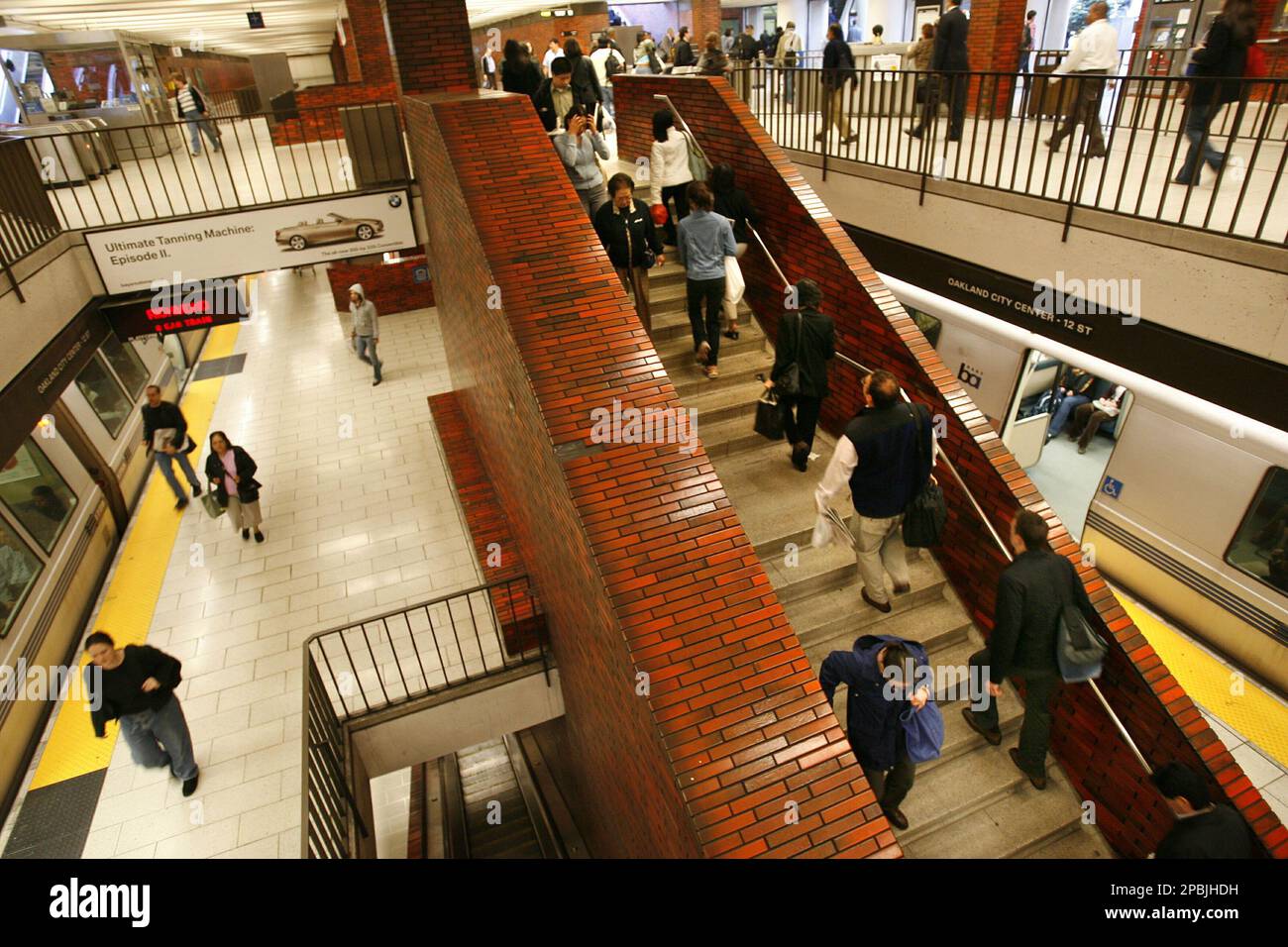 Passengers are seen at the 12th Street-City Center station in Oakland ...