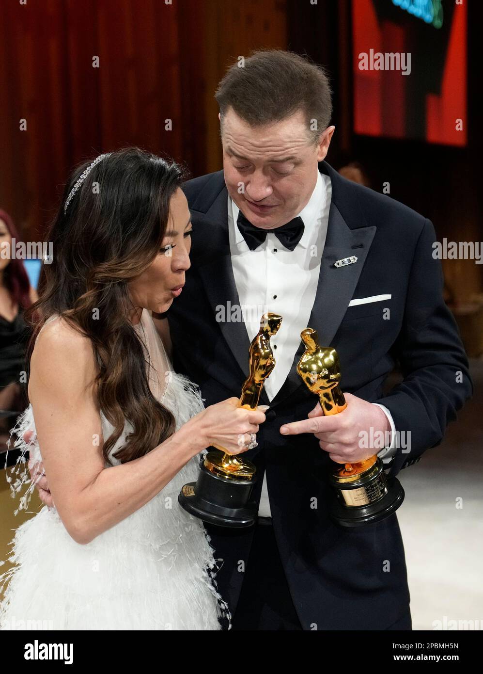 Michelle Yeoh, left, and Brendan Fraser pose with their awards at the ...