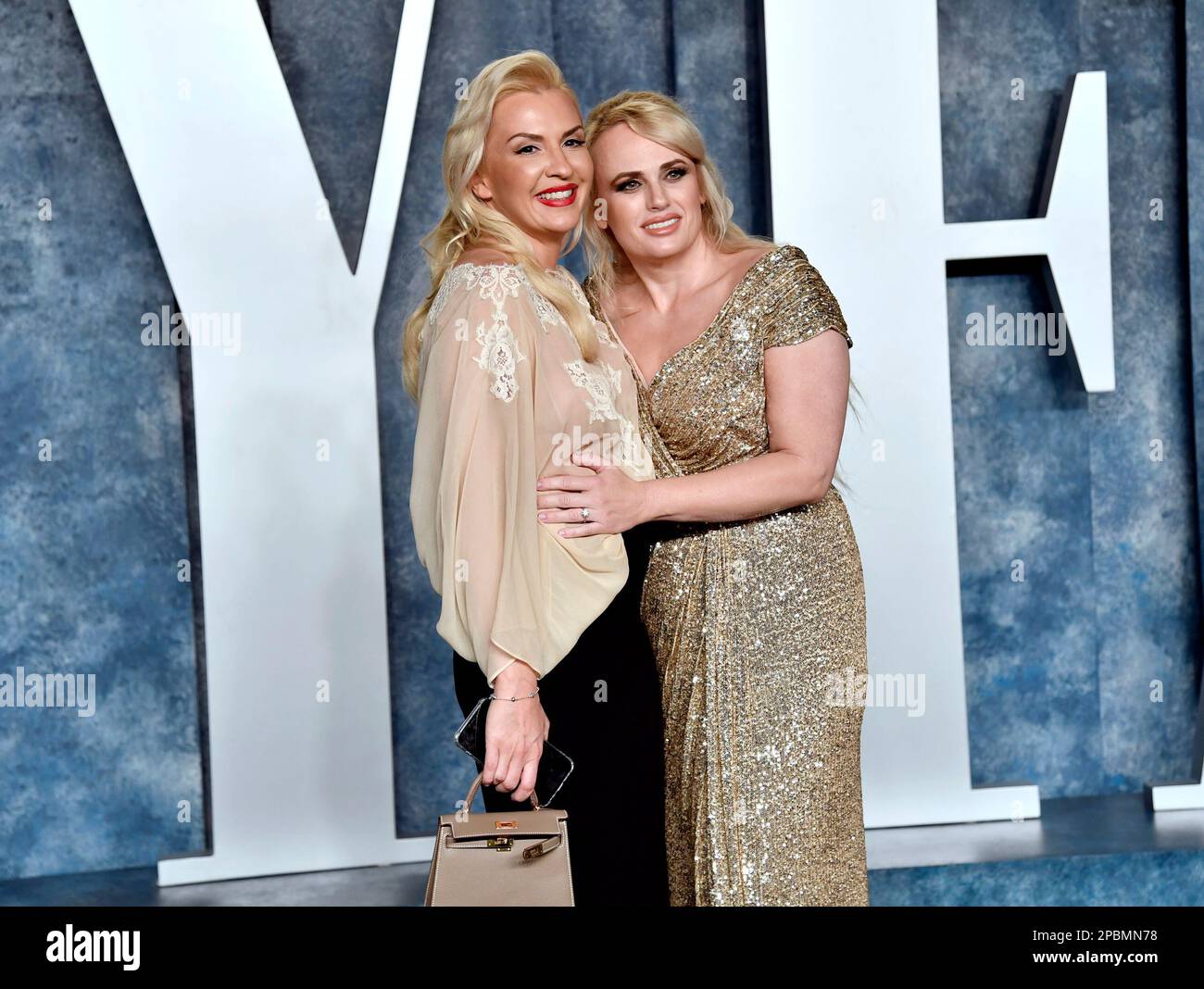 Ramona Agruma, left, and Rebel Wilson arrive at the Vanity Fair Oscar ...