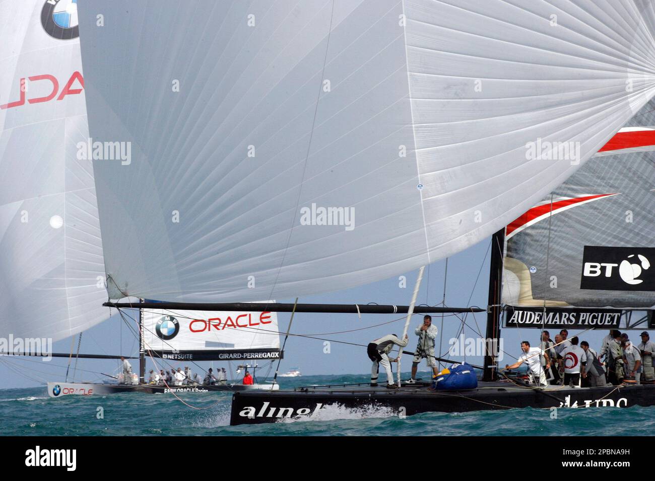 Swiss defender yacht Alinghi, SUI 91, right, and US's challenger yacht ...