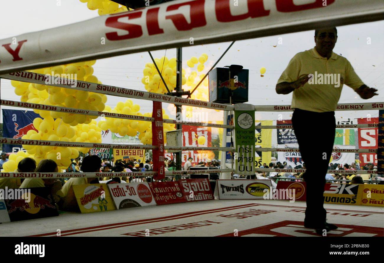 Fire caused by a balloon explosion is seen in the background at a ...