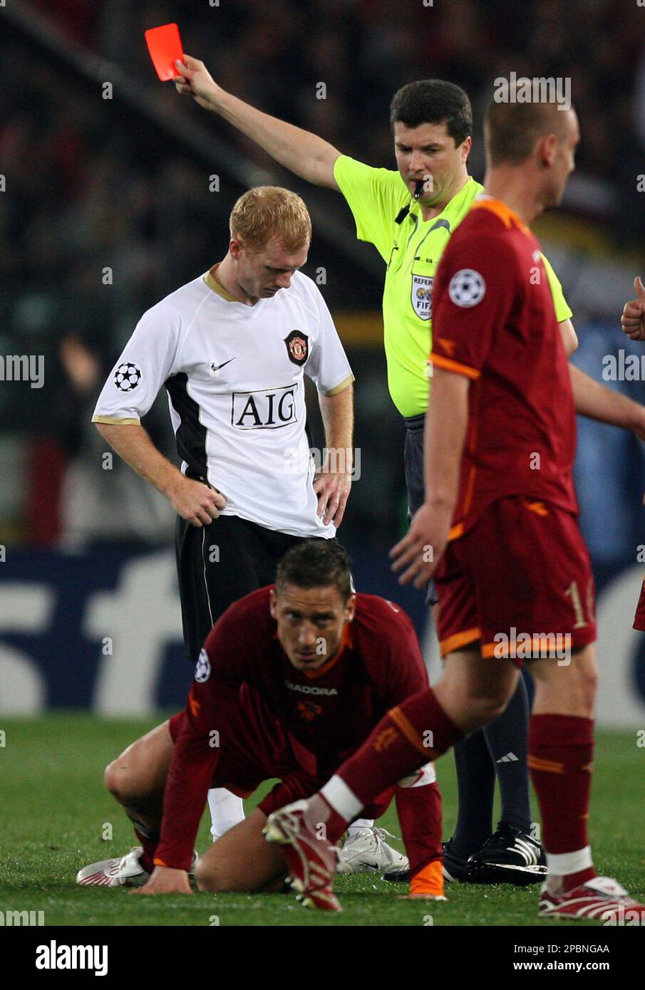 Manchester United's Paul Scholes, top left, receives a red card after a ...