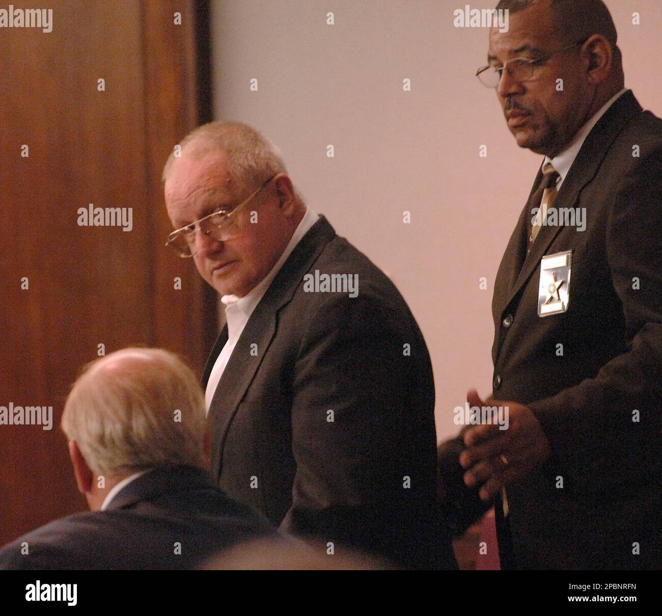 David Edenfield, center, enters the courtroom for his arraignment in Glynn County Superior Court ...