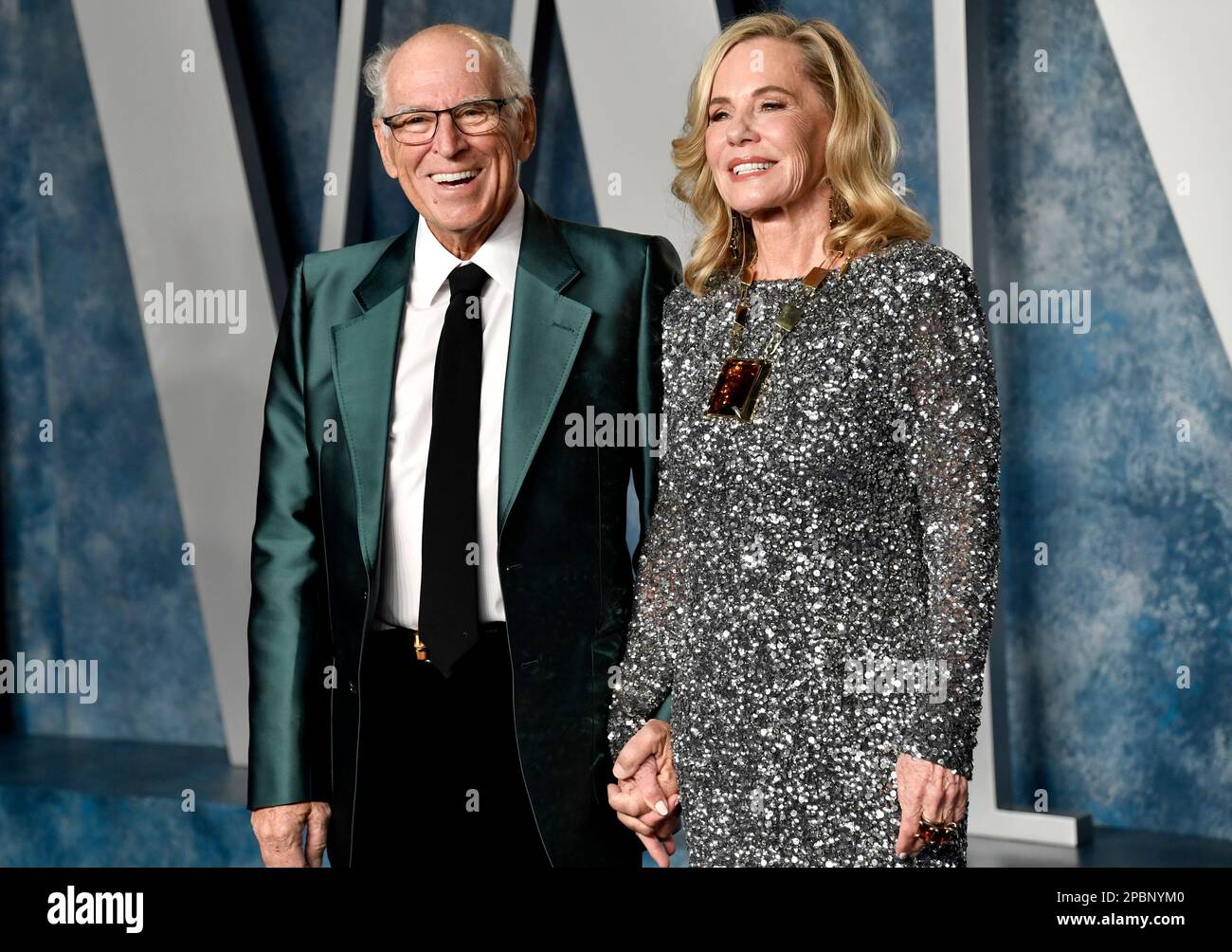 Jimmy Buffett, left, and Jane Slagsvol arrives at the Vanity Fair Oscar ...