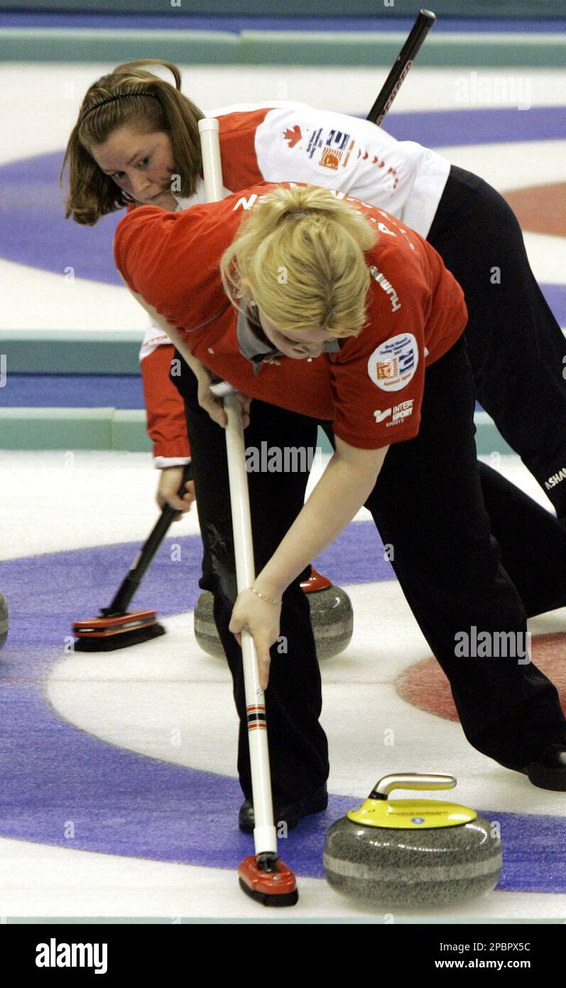 Canada's skip Kelly Scott, left, glances over at Denmark's skip ...