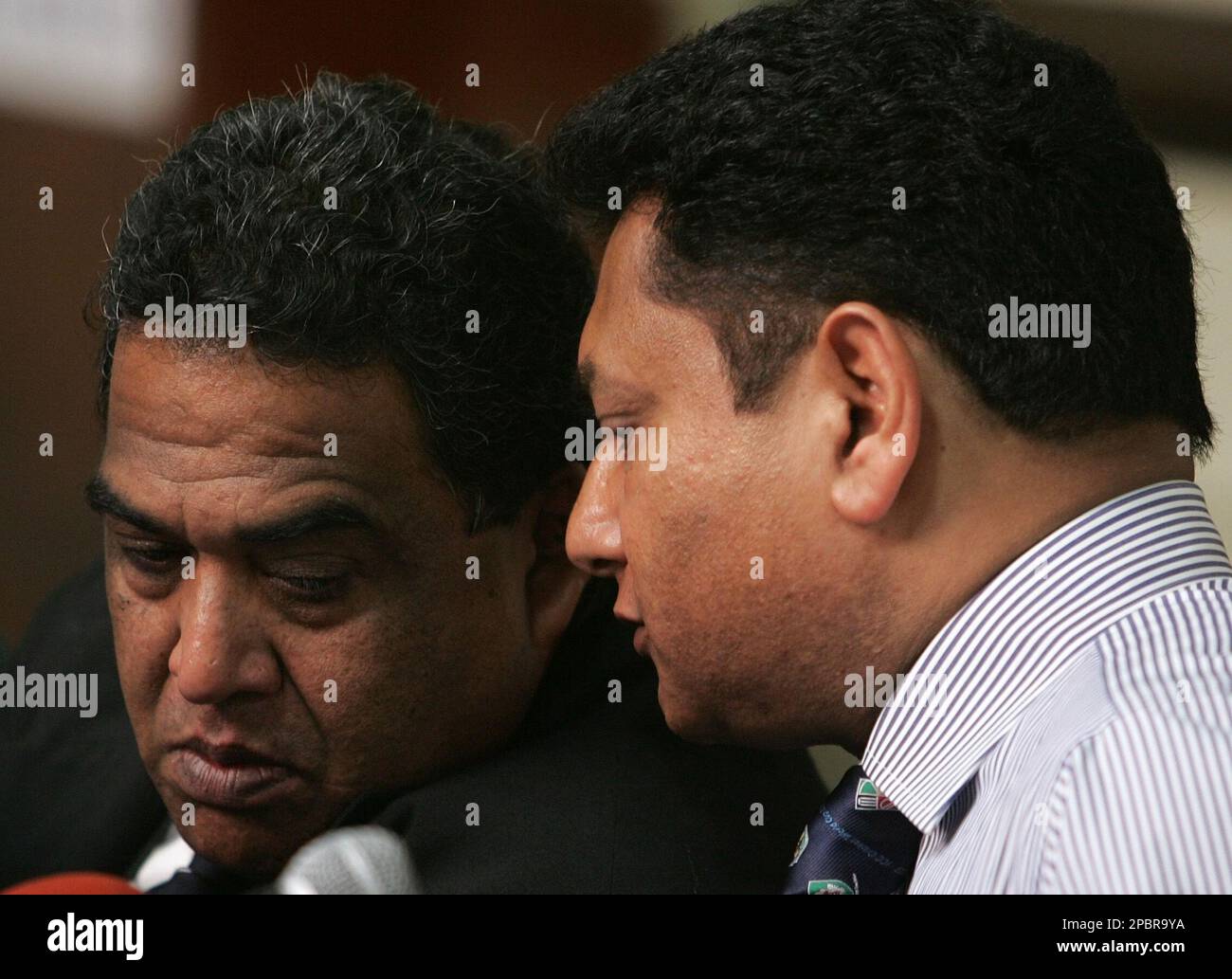 The Pakistan team's media manager, Pervez Jamil Mir, right, talks to ...