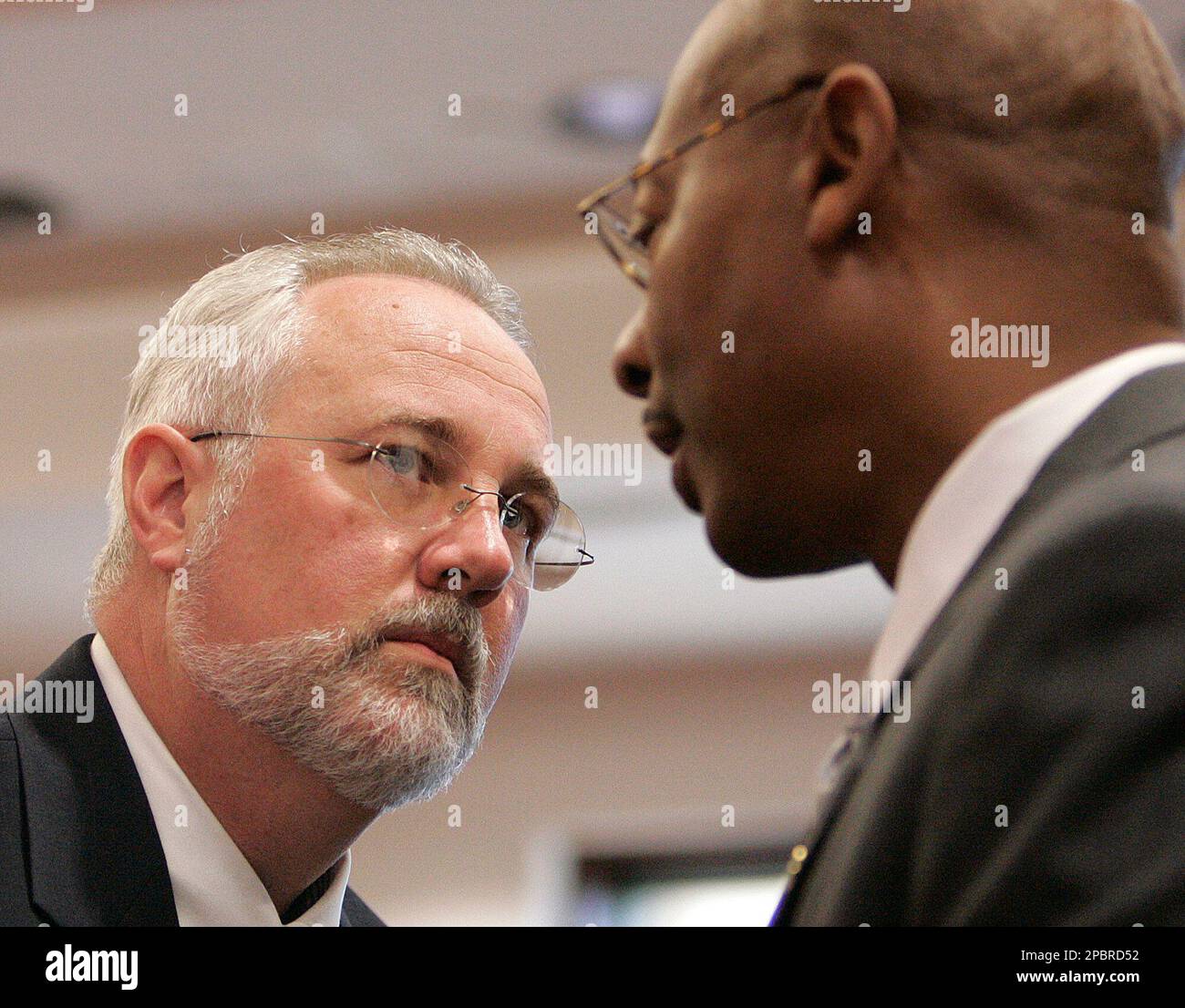 Prosecuting attorney Frank Allman, left, speaks with Mark Jones, the ...