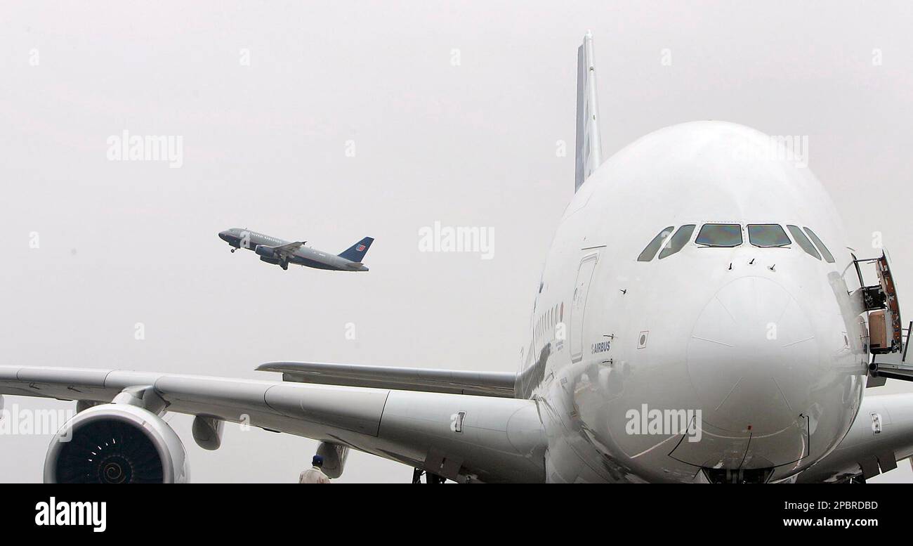 A United Airlines flight takes off behind the Airbus A380, Monday ...