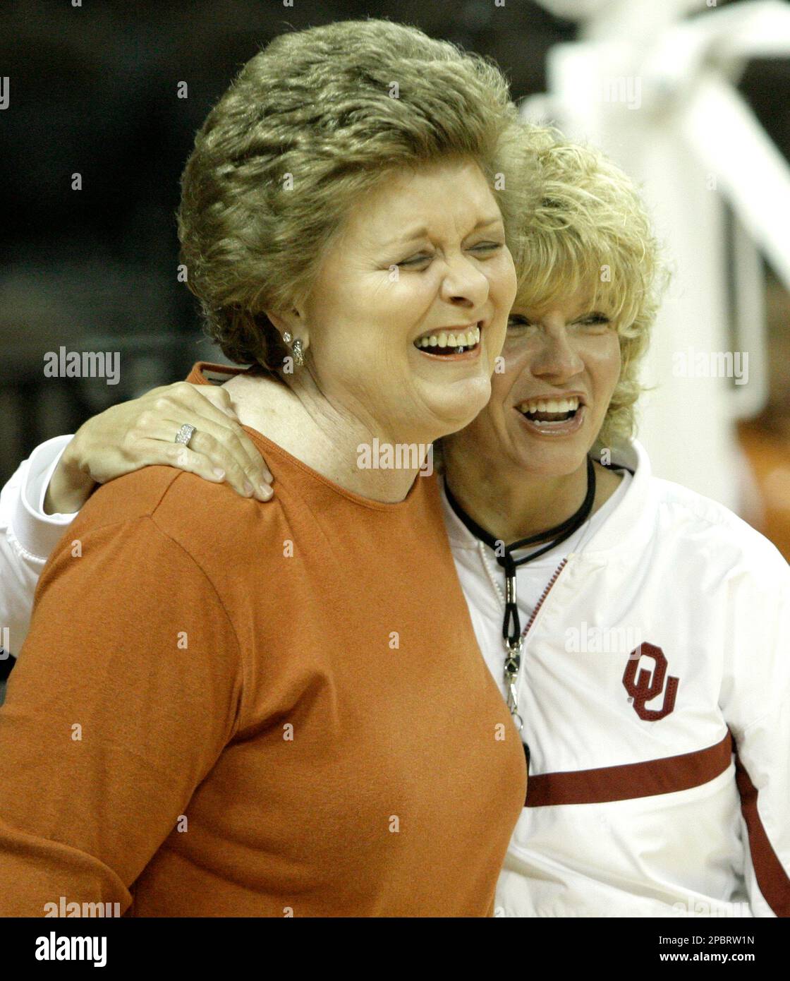Oklahoma coach Sherri Coale, right, hugs Texas coach Jody Conradt ...