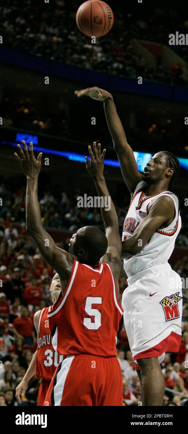 Maryland's James Gist, right, shoots over Davidson's Boris Meno (5 ...