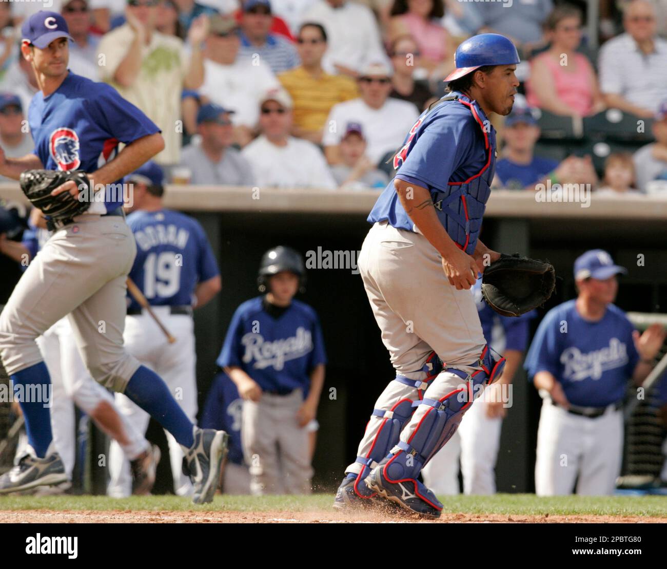 Chicago Cubs catcher Henry Blanco, right, waits for a throw home as ...