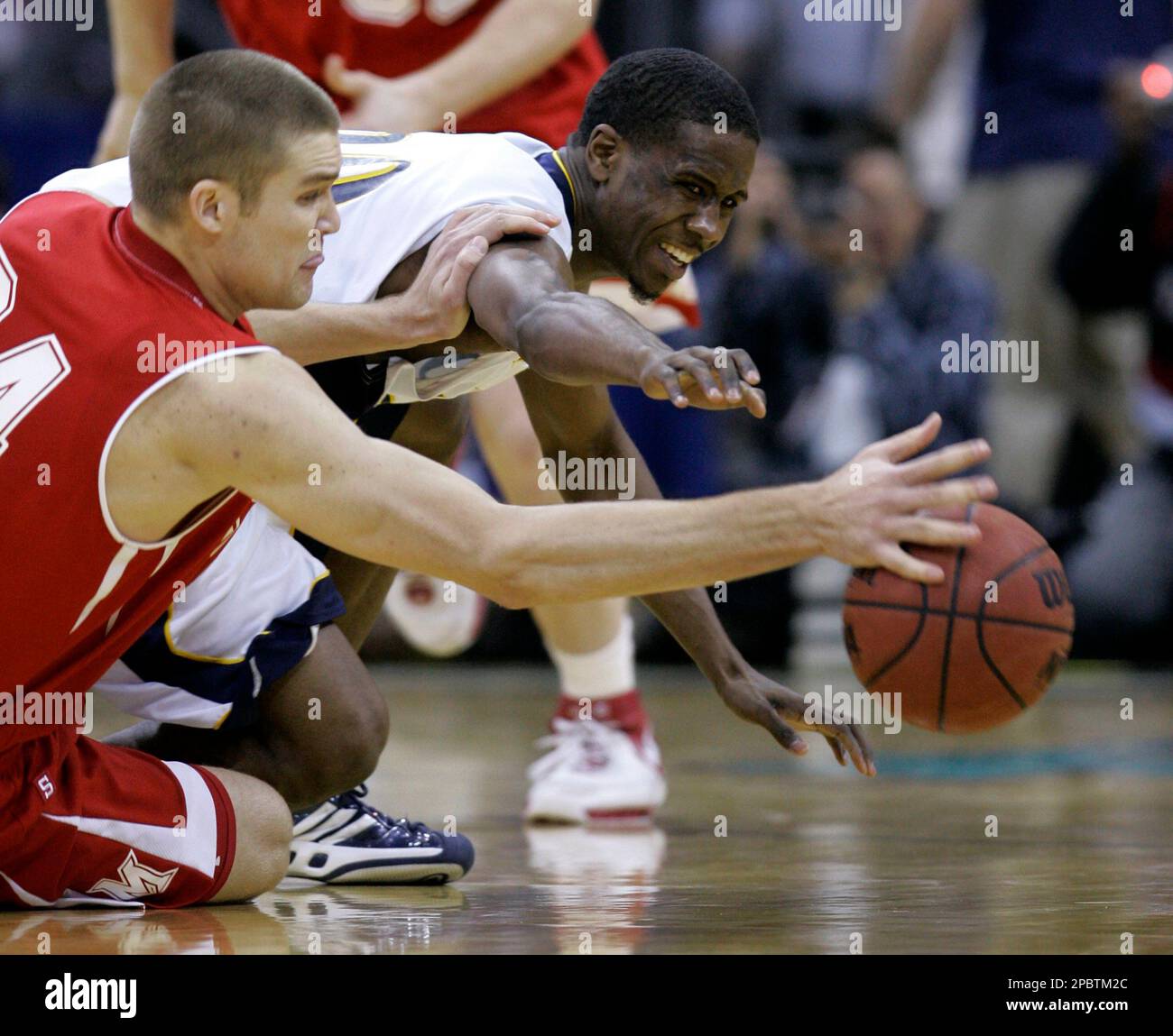 Miami of Ohio's Michael Bramos, left, and Toledo's Justin Ingram battle ...