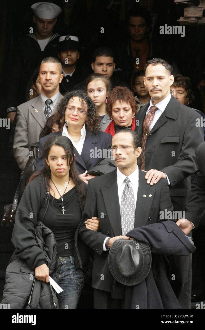 Peter Colon, right, standing with his daughter Alexandra, left, his ...