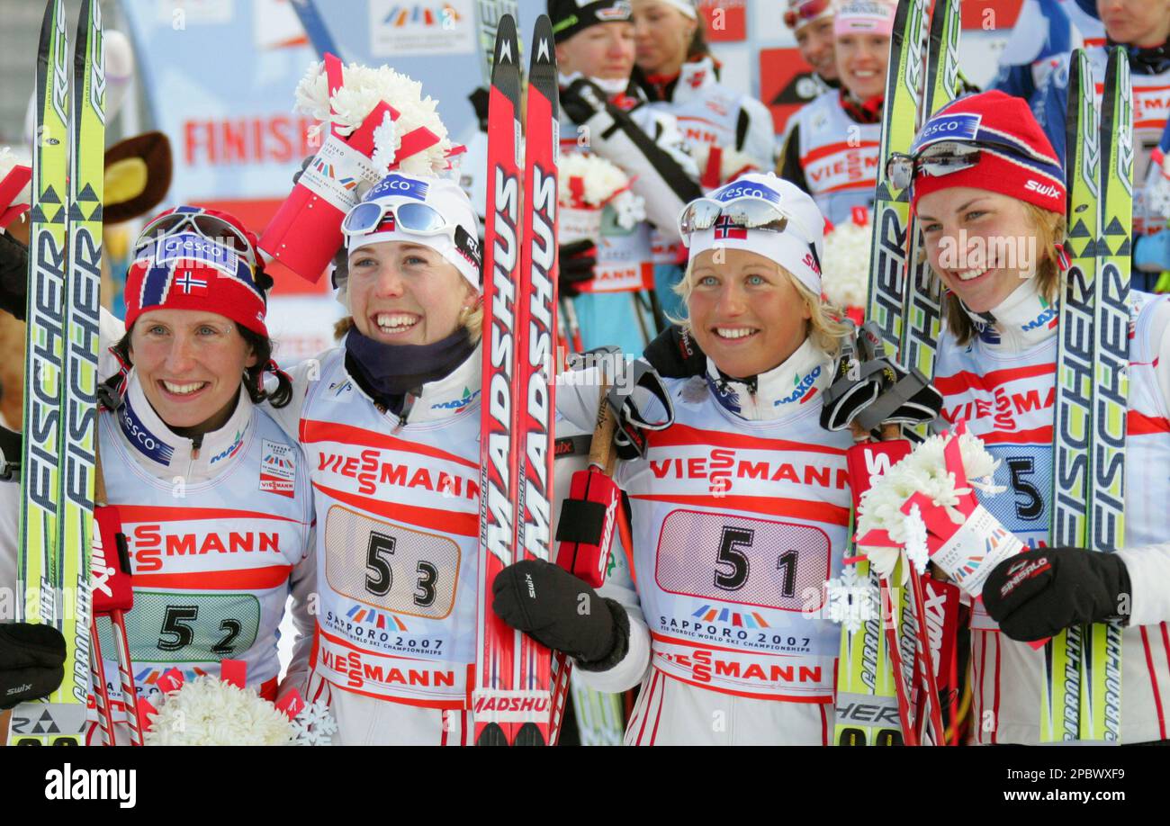 Norway's bronze medalists from left, Marit Bjoergen, Stoermer Steira ...