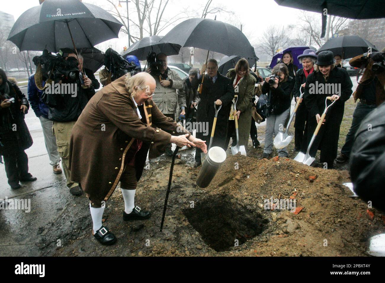 Ralph Archbold, left, portraying Benjamin Franklin, tosses a time ...