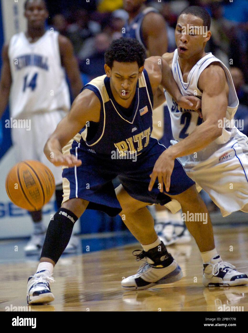 Seton Hall's Paul Gause, right, slaps the ball away from Pittsburgh's ...