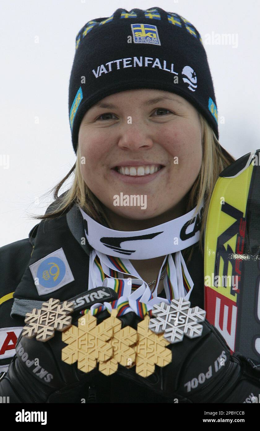 Anja Paerson, of Sweden, shows her medals after completing the Nations ...