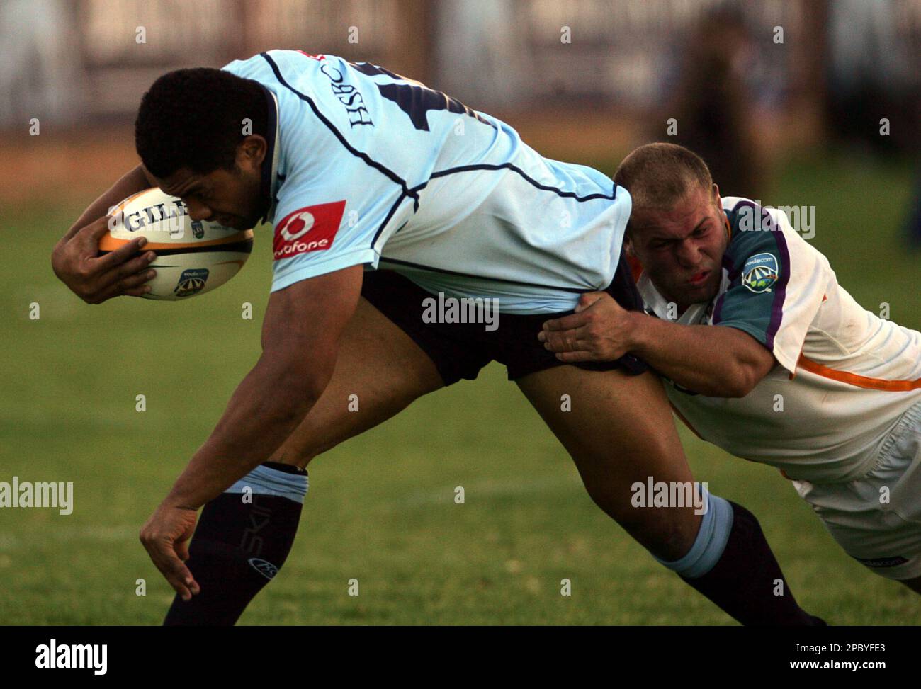 South Africa's Cheetahs Richard Strauss, right, tackles Australia's ...