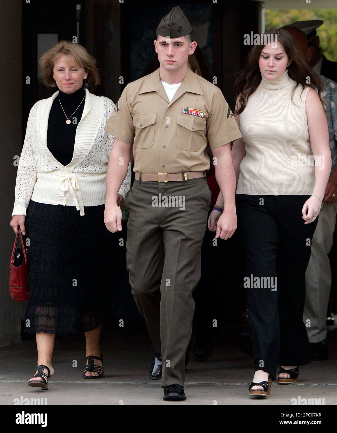 U.S. Marine Lance Cpl. Robert B. Pennington, center, walks to his court ...