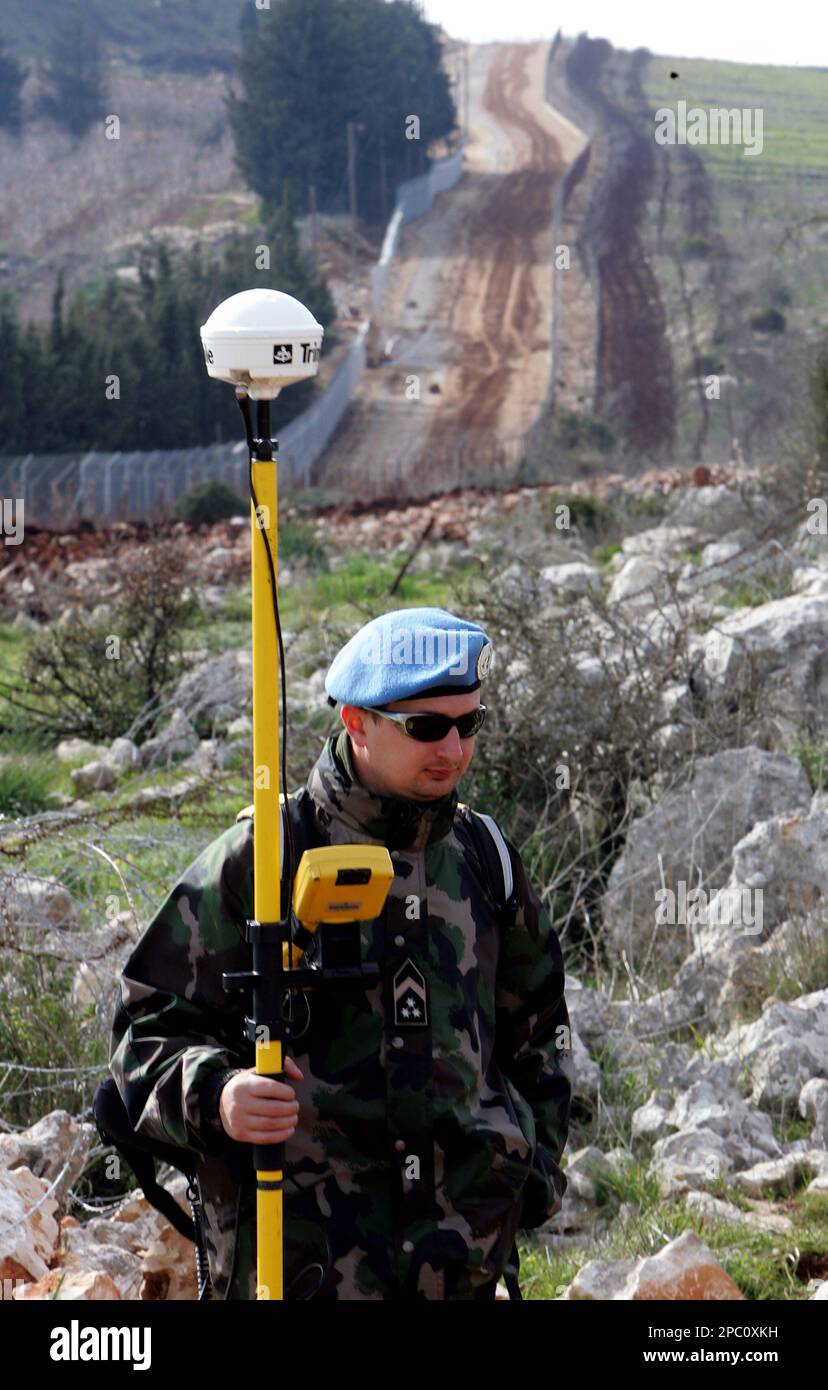 An Italian U.N peacekeeper soldier uses differential GPS device to ...