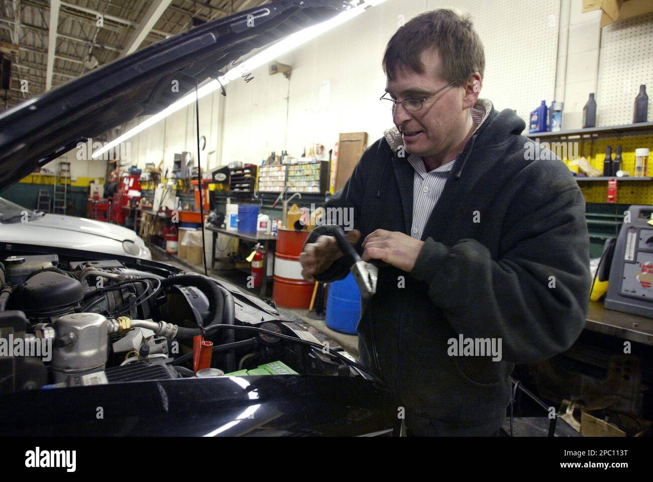 Kevin Kildea works on a car in his repair shop, Kildea Kar Kare Inc ...