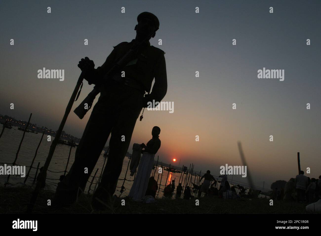 An Indian para-military force soldier stands guard at the Sangam, the ...