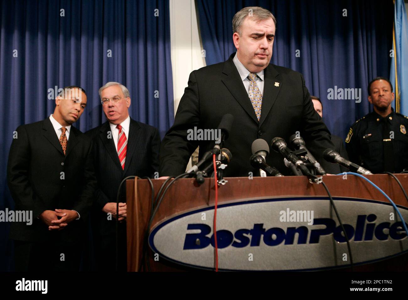Boston Police Commissioner Ed Davis, front right, faces reporters as ...
