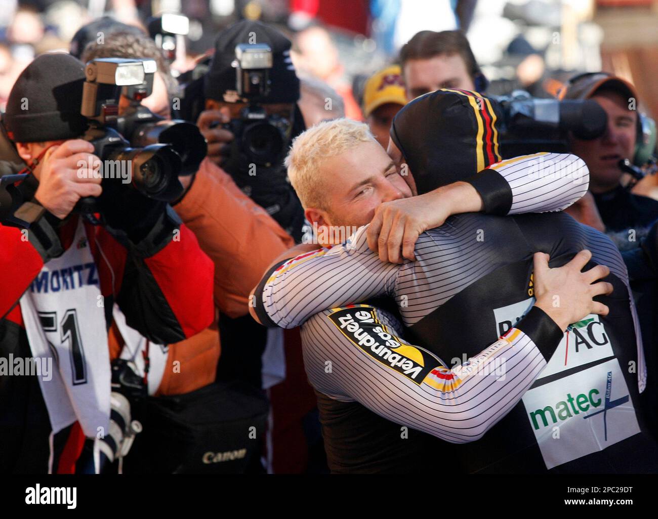 Gold medal winners Andre Lange, center left, and Kevin Kuske right ...