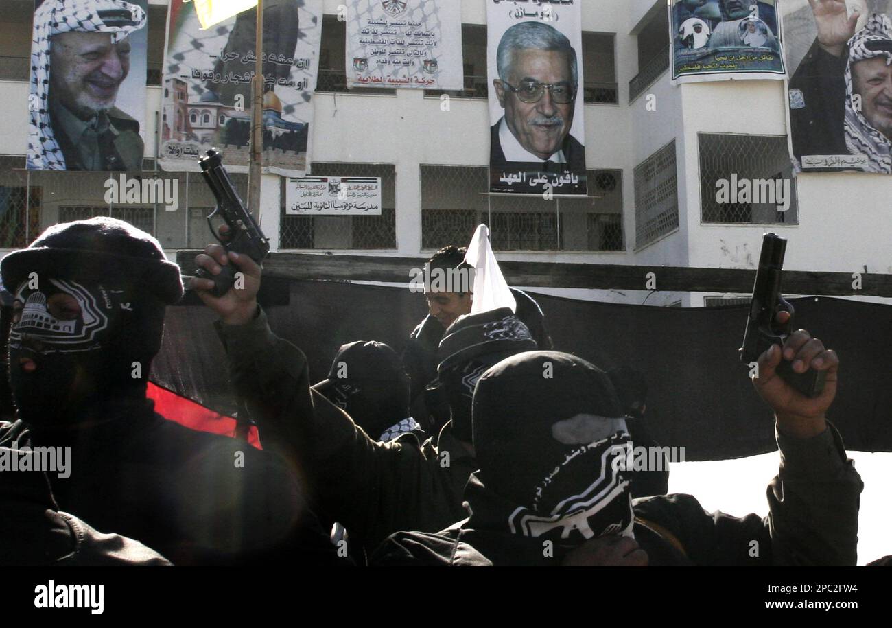Palestinian gunmen from the Fatah party hold their weapons during a ...