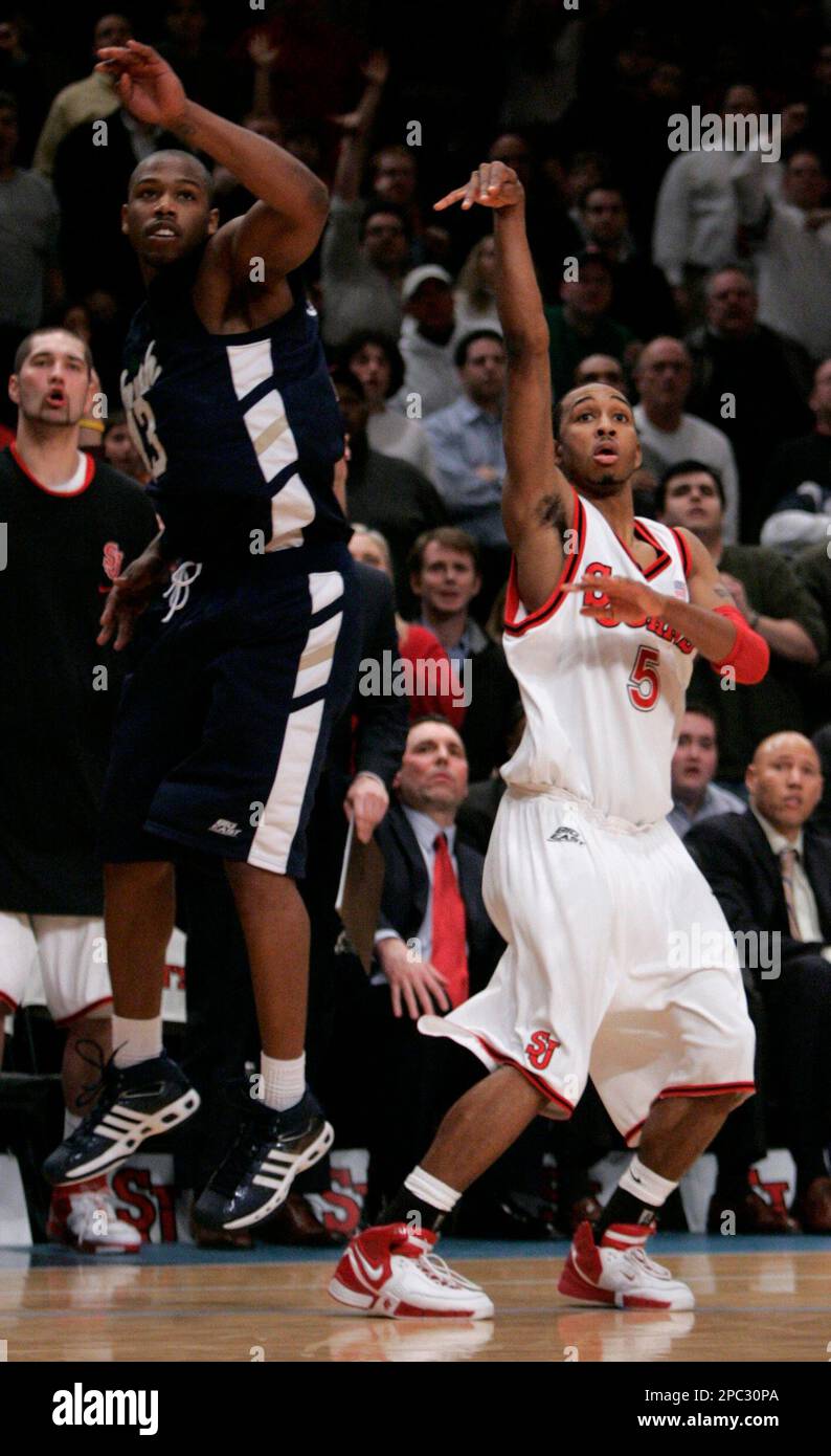 St. John's Larry Wright, right, watches his game-winning shot against Notre Dame's Russell ...