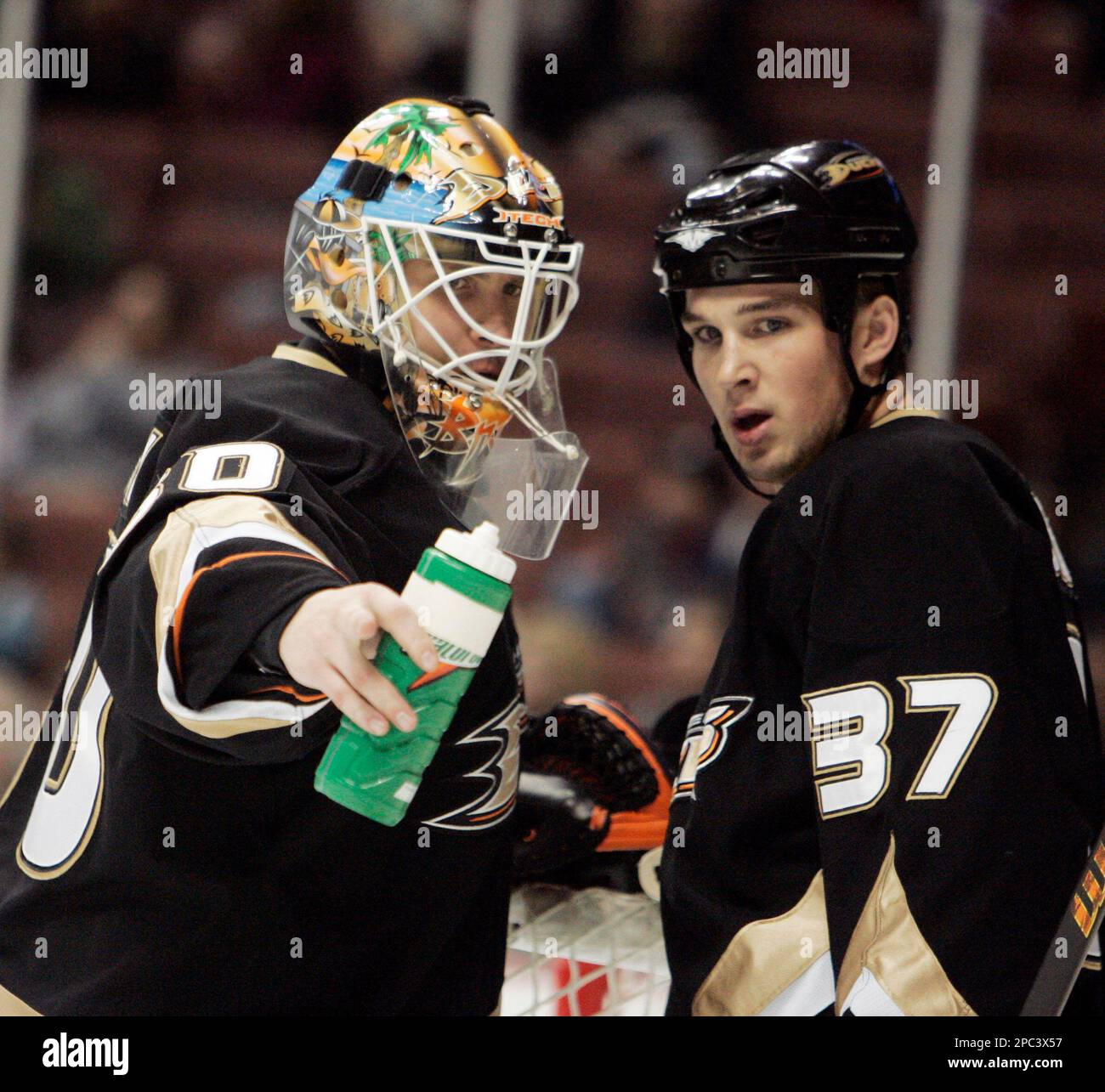 Anaheim Ducks goalie Ilya Bryzgalov, of Russia, talks with defenseman ...