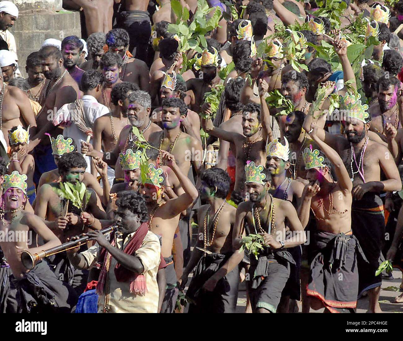 Pilgrims bound for south Indian temple, Sabari Mala take part in the ...