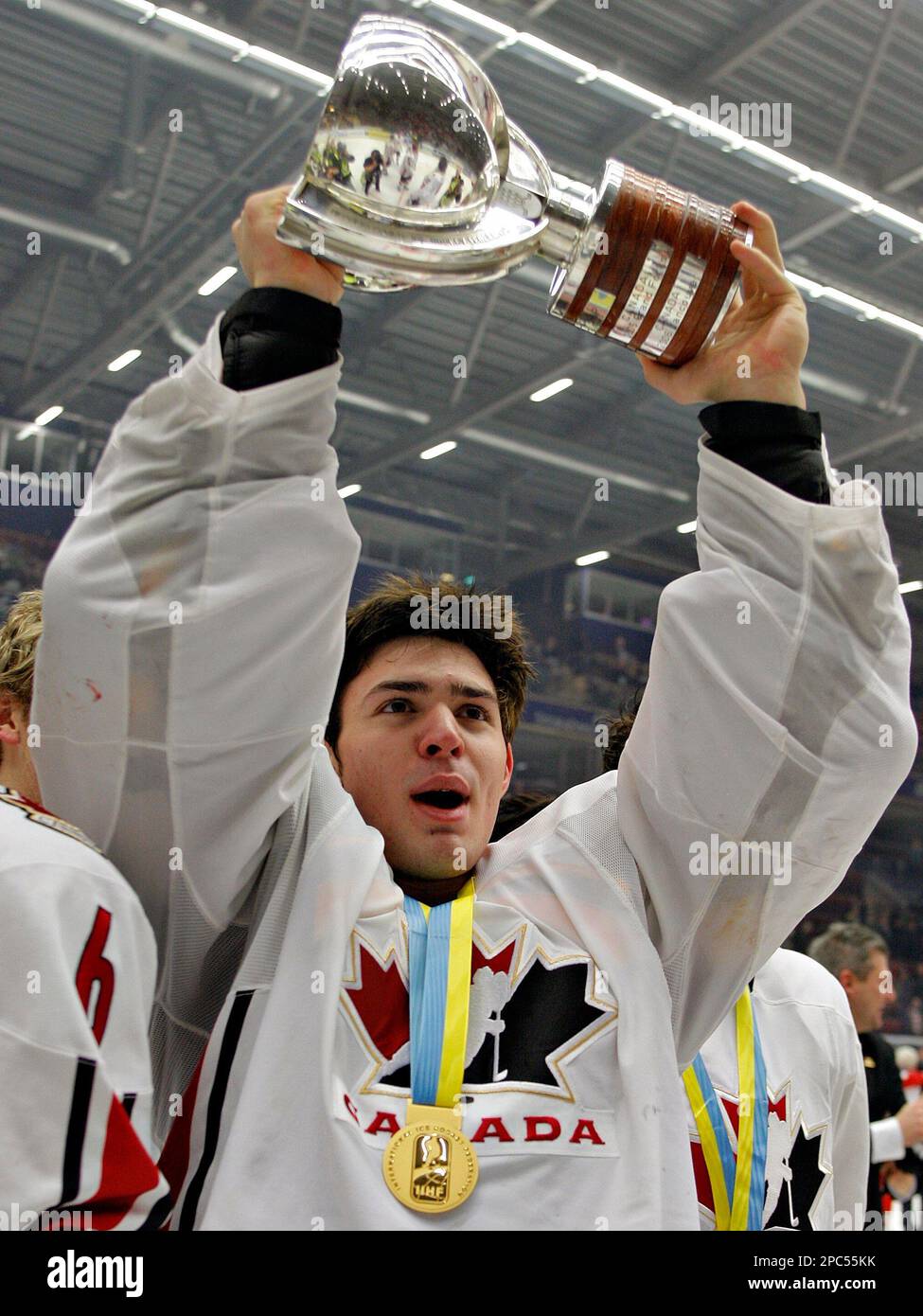 Team Canada goalie Carey Price raises the championship trophy after ...