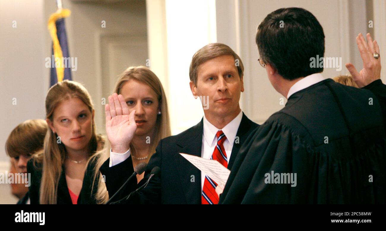 With his children, from left, Hayden, Julia, and Jackie at his side ...