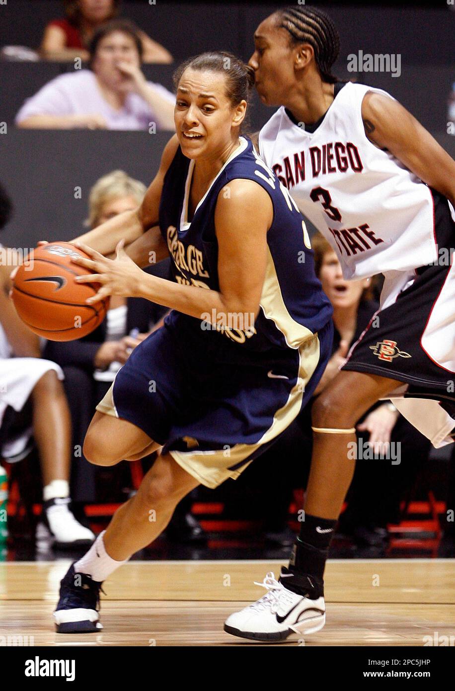 George Washington's Sarah-Jo Lawrence, left, drives past San Diego ...