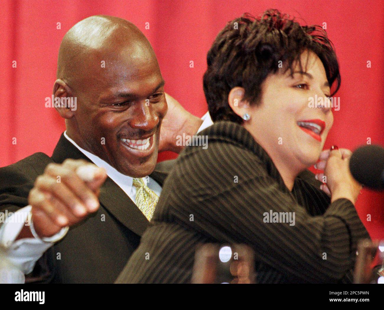 **FILE** Chicago Bulls' Michael Jordan, left, laughs as his wife ...