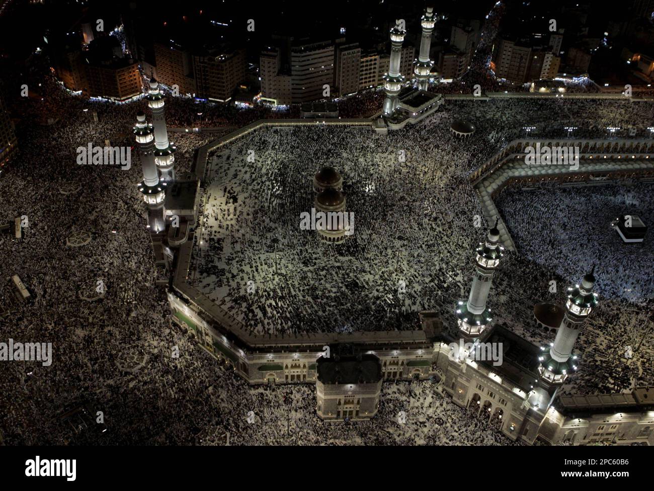 Tens of thousands of Muslim pilgrims attend night prayers around the ...