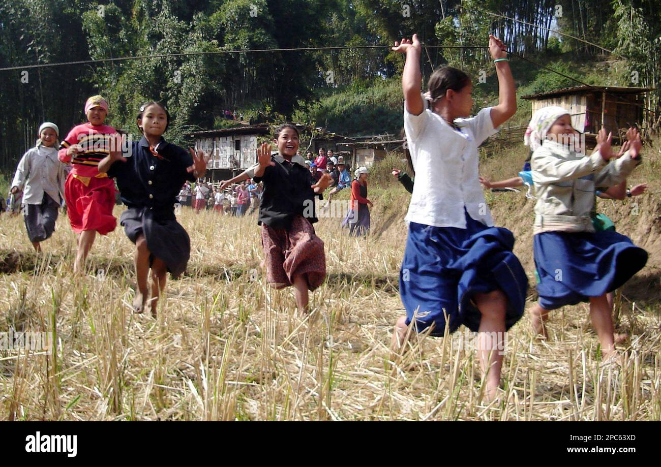 In this photo released by Free Burma Rangers, Christian Karen girls run ...