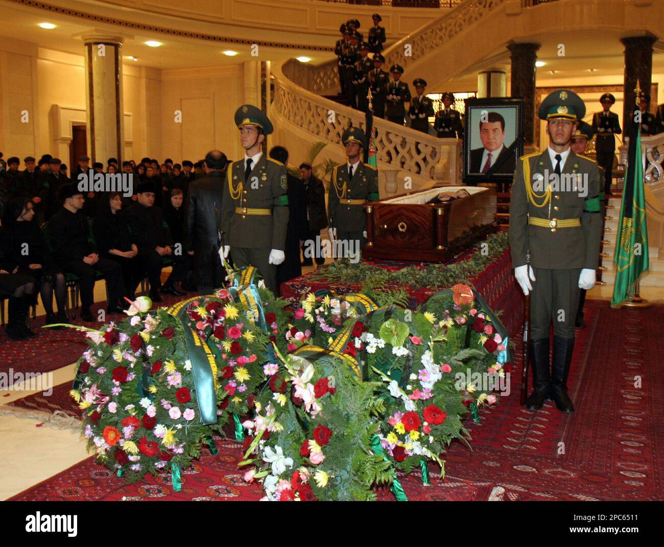 Turkmen soldiers stand around the coffin of the late President ...