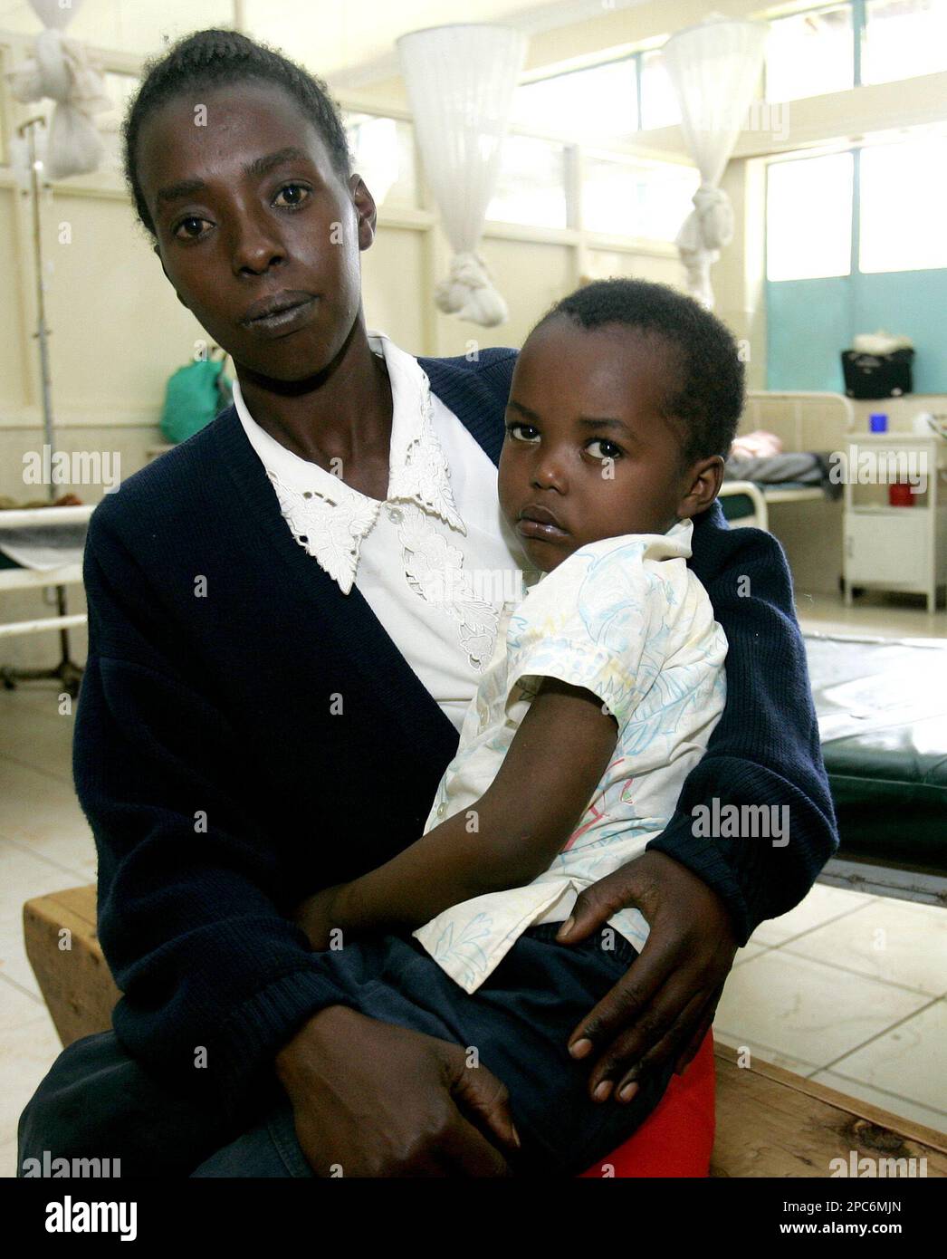 Dennis Mwenje is held his mother Priscilla Nyawira in Karatina Hospital ...