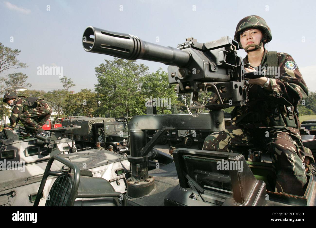 Philippine Army CPL Janet Ang mans her multiple grenade launcher ...