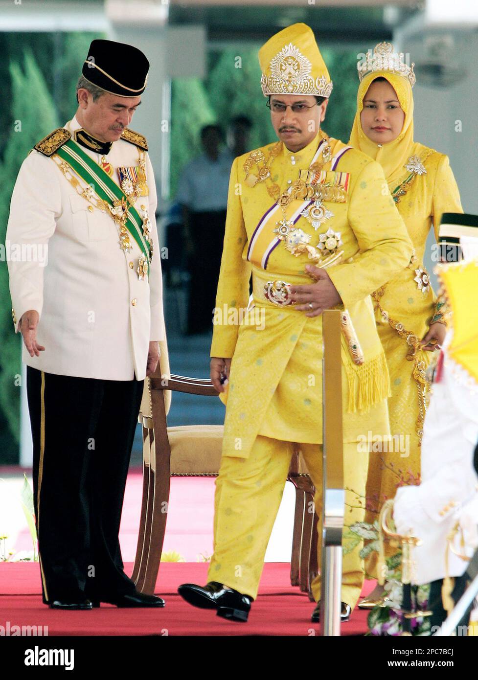 Malaysia's new King Sultan Mizan Zainal Abidin, center, followed by ...