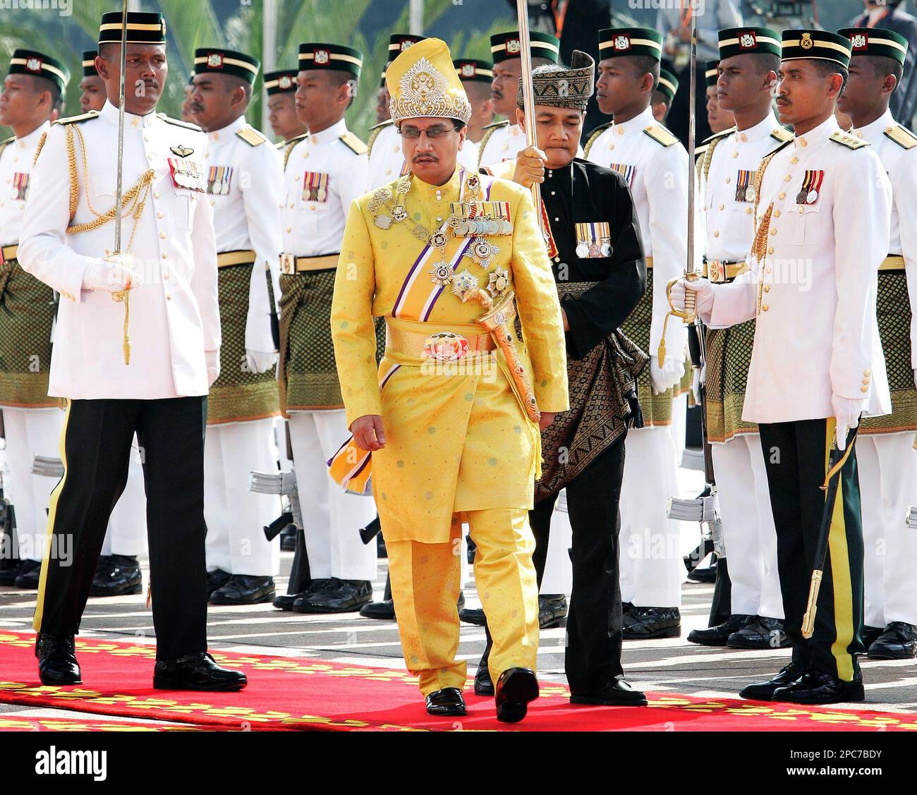 Malaysia's new King Sultan Mizan Zainal Abidin, center, inspects the ...